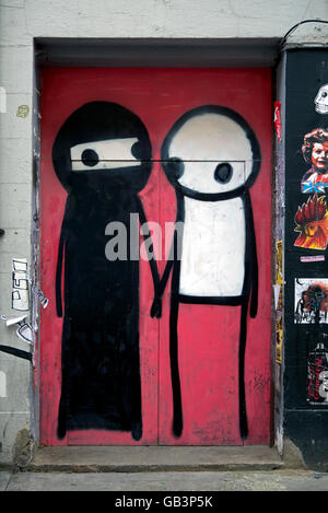 Street art by Stik - woman in traditional dress and man - black and ...