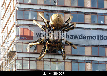 A giant spider hangs from the side of the Concourse Tower in Liverpool ...