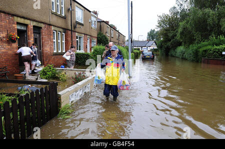 Residents of Morpeth, Northumberland leave their flooded homes ...