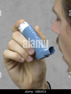 Stock picture of a male using an inhaler Stock Photo - Alamy