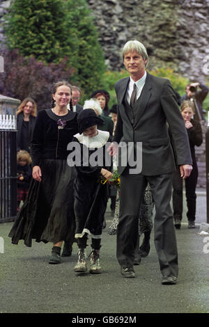 Dr Shaun Russell and daughter Josie walk away from the graveside after ...