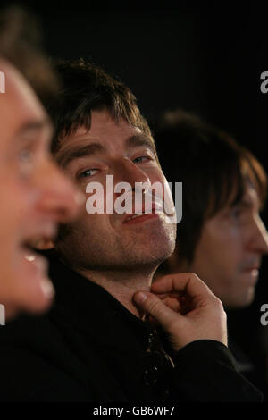 Noel Gallagher from the band Oasis plays his guitar as they perform ...