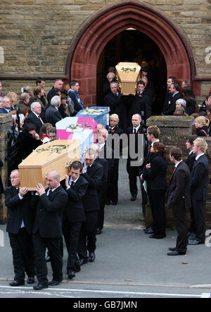 Mourners attend the funeral of David and Michelle Statham and their ...