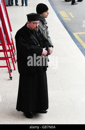 People observe two minutes of silence to mark the 87th anniversary of ...