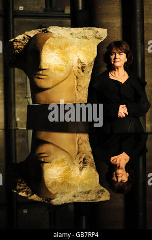 Contemporary sculptor Emily Young, stands by one of seven and a half ...