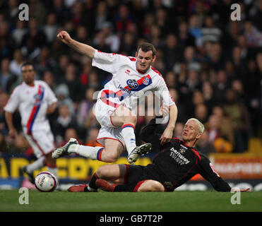 Crystal Palace's Craig Beattie and Barnsley's Bobby Hassell tussle for ...