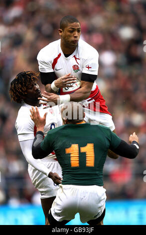 South Africa's Bryan Habana, top, catches the ball as Argentina's Juan ...
