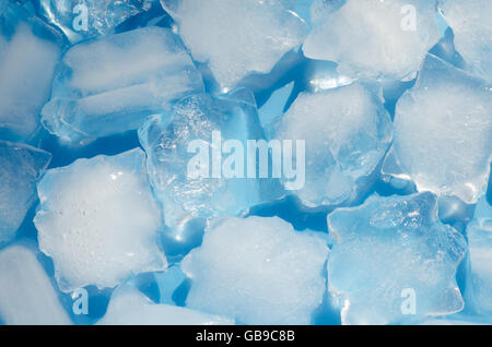 ice cubes on blue background Stock Photo - Alamy