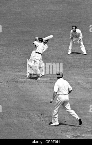 Australia's Neil Harvey (l) pulls England's Kenneth Cranston (second l ...