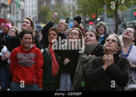 The crowd watches as Santa abseils down past the famous Clery's Clock ...