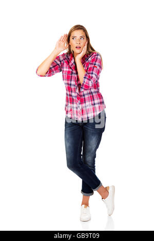 Portrait of woman overhearing a conversation Stock Photo - Alamy