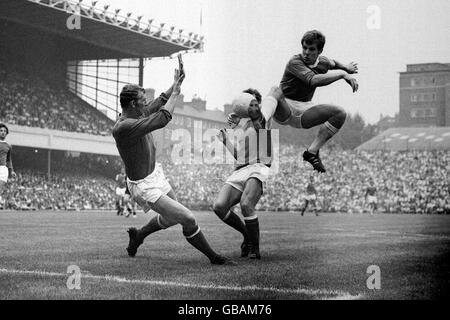 Arsenal goalkeeper Bob Wilson (l) saves from Everton's Joe Royle (r ...