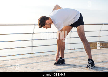 Young handsome man doing morning exercises Stock Photo - Alamy