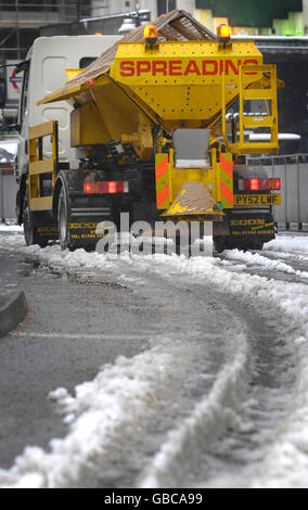 A snow plough and gritting lorry clears snow at Ribblehead, in North ...