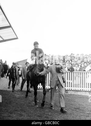 Woodland Venture (r), Terry Biddlecombe up, clears the last fence ahead ...
