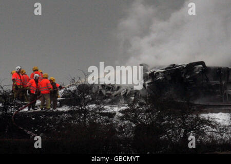 Firefighters at the scene of an 'intensive' blaze after a freight train ...