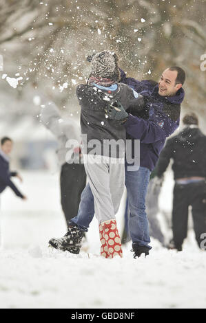 People throw snowballs in Victoria Park, Windmill Hill, Bristol after a ...