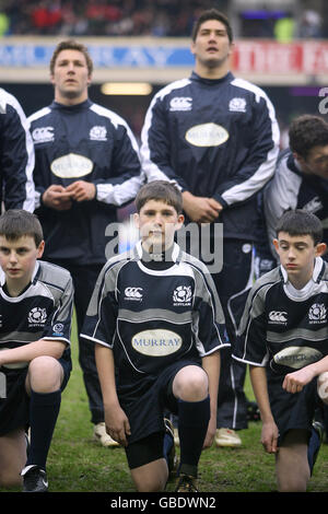 The Scotland mascots line up with the players pre-match at Murrayfield ...