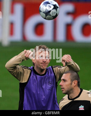Liverpool's Dutch striker Dirk Kuyt, centre, takes part in a training ...