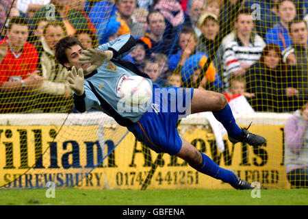 Shrewsbury Town's goalkeeper Scott Howie makes a save during the ...