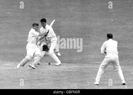 Kent's Tony Pawson (l) mistimes a pull, watched by Middlesex ...