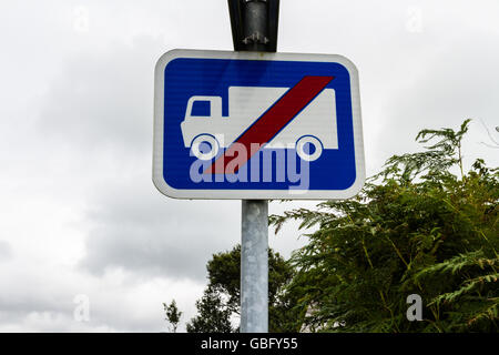 Blue sign showing lorry or HGV with red line through it and a satellite ...