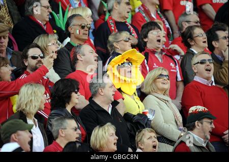 Welsh fans sing the Welsh national anthem at the Welsh Football team ...