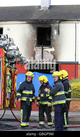 Firefighters outside the remains of a house in Romford Road, Forest ...