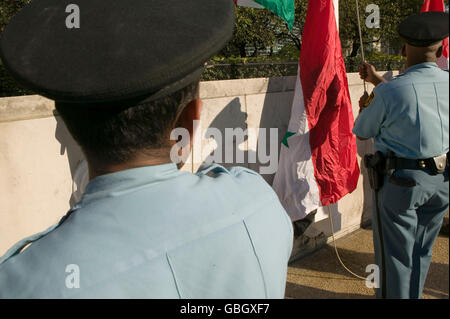 United Nations security guards raise the member states flags in front ...
