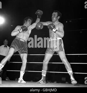 Kevin Finnegan (left) throws a powerful left that fails to connect Alan ...