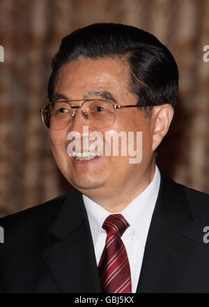 Chinese President Hu Jintao smiles while greeting journalists after ...
