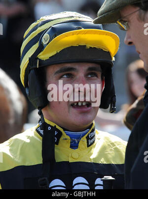 Jockey Liam Treadwell celebrates after winning the John Smith's Grand ...