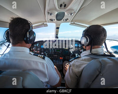 Controlling a small aircraft in the flight deck, view of the runway ...