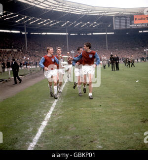 West Ham United's John Sissons and Geoff Hurst parade the FA Cup during ...