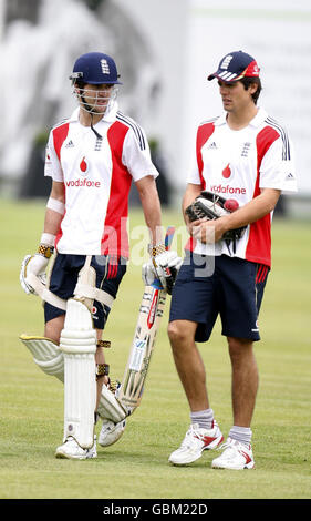 England's James Anderson (left) and Alastair Cook (right) look-on ...