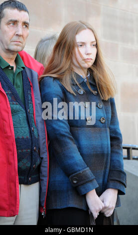 Matthew Pyke's girlfriend Joanna Witton listens to a statement being ...