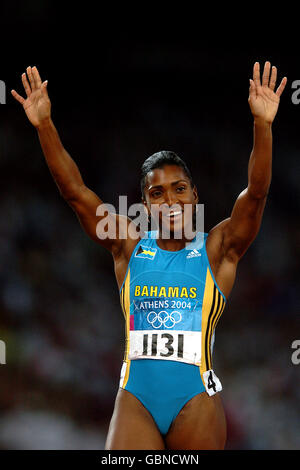 Tonique Williams-Darling, of the Bahamas ,celebrates after she won the ...