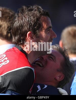 Rangers goalkeeper Neil Alexander, left, runs out to challenge Zenit St ...