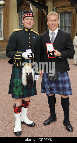 Major Nicholas Calder outside Buckingham Palace after being awarded the ...