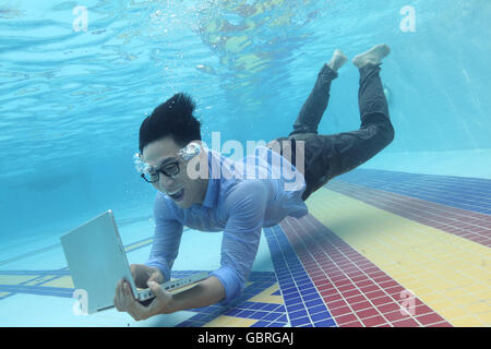 Business men use computers under water Stock Photo - Alamy