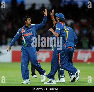Indian players celebrate after the wicket of Australia's Travis Head ...