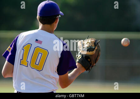 Baseball player catching ball in baseball glove Stock Photo - Alamy