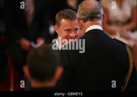 Wing Commander Anthony Keeling is made an MBE by the Prince of Wales at ...