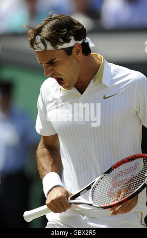 Swiss player Roger Federer reacts during a press conference at the ...