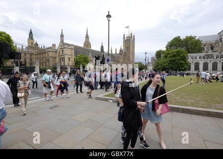 Asian tourists take a selfie in at Shibuya Crossing in Tokyo. January 9 ...