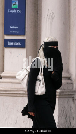 Woman wearing burqa on London street Stock Photo - Alamy