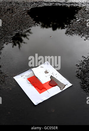 Learner Drivers. A torn L plate lies on the ground Stock Photo - Alamy