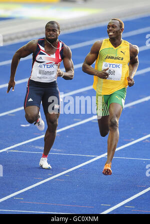 Jamaican sprinter Usain Bolt passes the button to Jenna Prandini in the ...