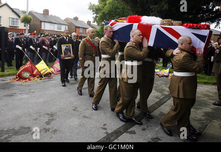 The coffin of Fusilier Simon Annis, 22, is carried into the church of ...