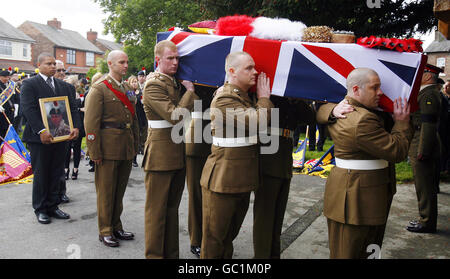 The coffin of Fusilier Simon Annis, 22, is carried into the church of ...